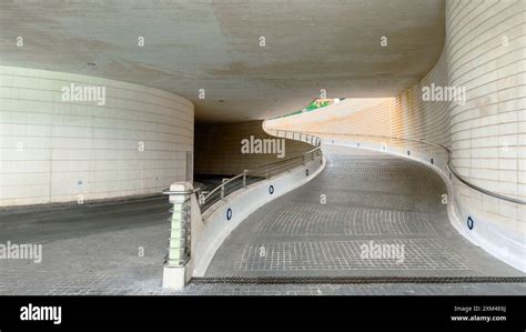 Curved Architectural Design In A Modern Building Highlighting Innovative Use Of Space And