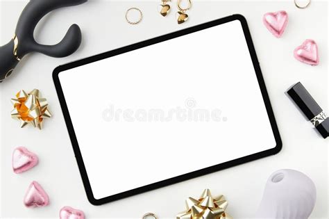 Top View Of Digital Tablet With Blank Screen Sex Toys Female Accessories And Candies Stock