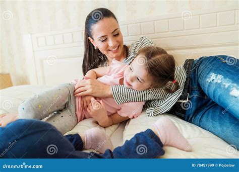 Mother Having Fun With Her Daughters In Her Bedroom Royalty Free Stock