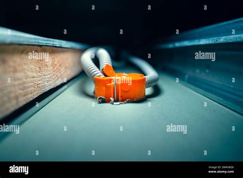 Orange Embedded Socket For An Electrical Outlet Mounted Inside A