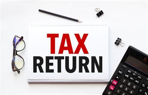 Premium Photo Business Concept Notebook With Text Tax Return Sheet Of White Paper For Notes