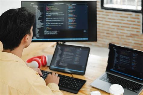 premium photo it programmer starts working on desktop computer the website developer software