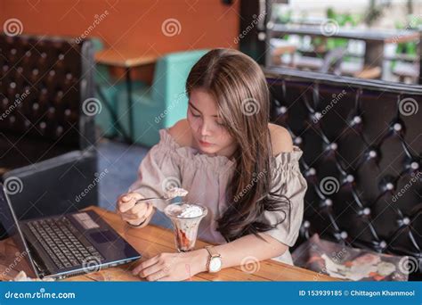 Beautiful Girl Sitting To Eat Ice Cream In The Shop Stock Image Image