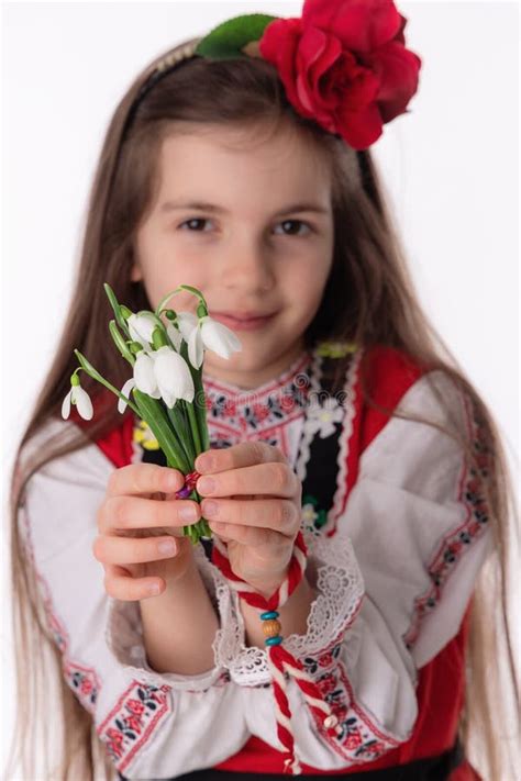 Bulgarian Woman With Bouquet Spring Snowdrop Flowers And Martenitsa March Holiday Baba Marta