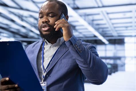 Supervisor Talks About Server Room Workspace Configurations During Call