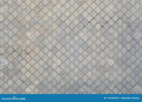 The Texture Of A Rhythmic Mosaic Made Of Concrete Tiles Background Image Of A Large Area Of Old