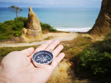Holding On A Compass Showing Your Direction And Your Navigation By