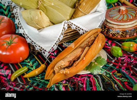 Tamales Mexican Dish Made With Corn Dough Chicken And Chili Wrapped With A Corn Leaf Stock