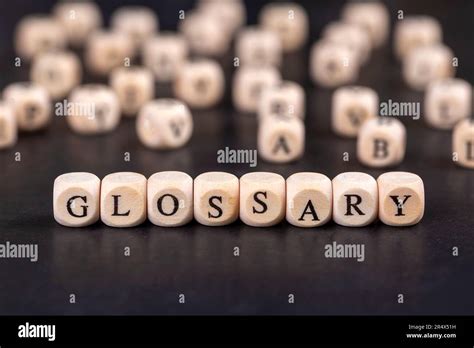 Glossary Word From Wooden Blocks With Letters Alphabetical List With Words Meanings