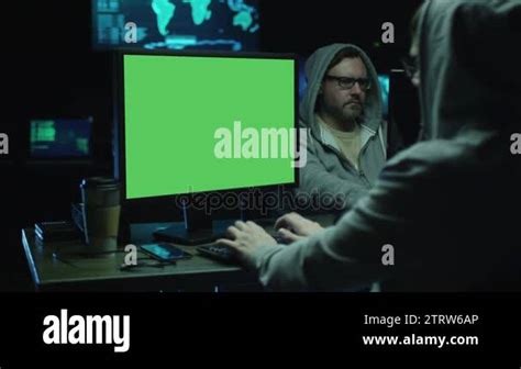 Concentrated Programmers Work On Personal Computers Located In A System