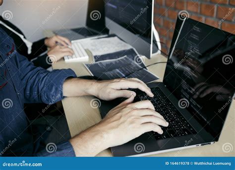 Two Partnerships Developing Programming And Coding Technologies Working On Laptop And Analyzing
