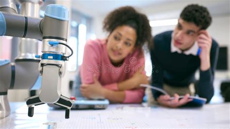 Male And Female College Or University Engineering Students In Robotics