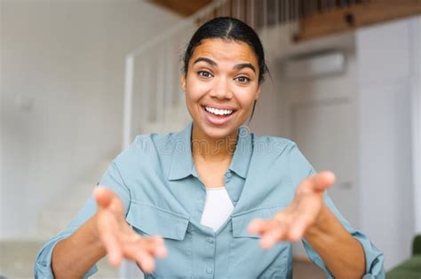 Webcam Shot Of Young Positive Woman Communicating Via Video