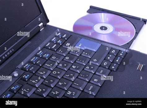 Brand New Laptop With Cd In Open Cd Drive Shot On White Stock Photo Alamy