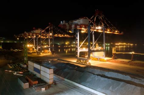 Premium Photo Sea Port Container Terminal During Work At Night In Fog