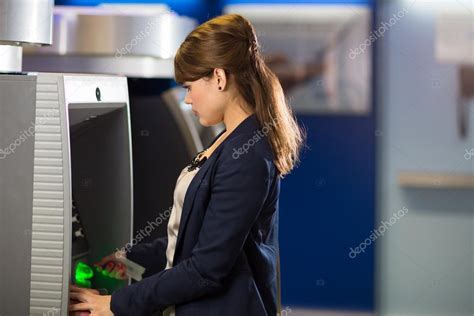 Woman Withdrawing Money At ATM Stock Photo Lightpoet
