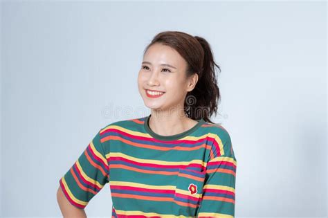 Cute Asian Girl Showing White Healthy Smile Grinning Standing Over