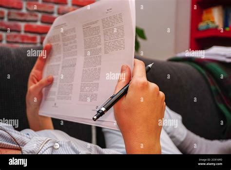 Woman Studying At Home With Pencil And Study Notes In Hands Stock Photo Alamy