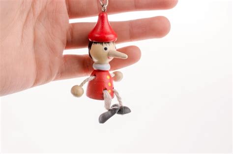 Premium Photo Pinocchio Puppet In Hand