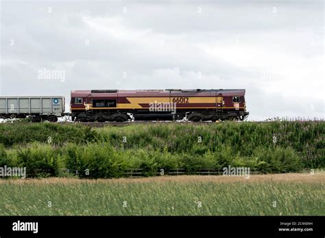 Db Class 66 Diesel Locomotive No66012 Pulling A Freight Train Side