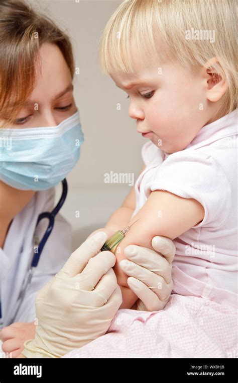 Nurse Giving Intramuscular Injection In Hi Res Stock Photography And