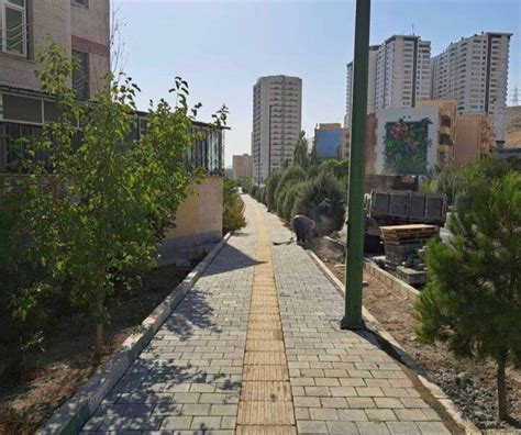 اتمام عملیات پیاده رو سازی در شهرک شهید باقری و نصب پایه چراغ دکوراتیو