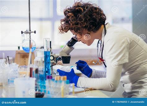 Lab Technician Assistant Analyzing A Blood Sample At Laboratory
