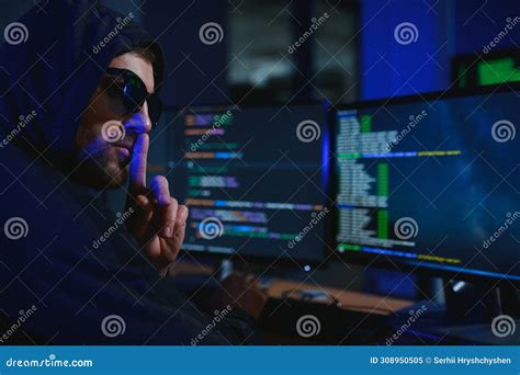 Hacker Sitting At Desk In Dark Atmosphere A Computer Programmer Or Hacker Anonymous Computer