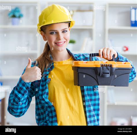 The Woman With Toolkit In Workshop Stock Photo Alamy