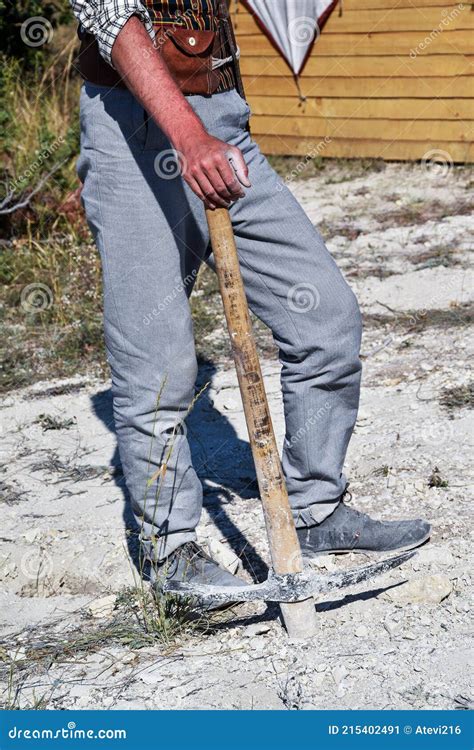 A Man With A Pickaxe Is Mining Gold Stock Image Image Of Mystery Metal 215402491