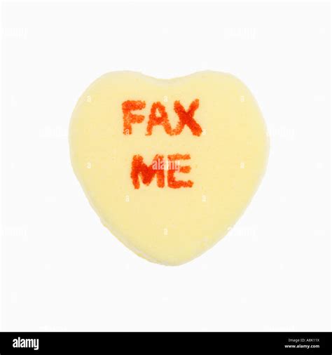 Yellow Candy Heart That Reads Fax Me Against White Background Stock