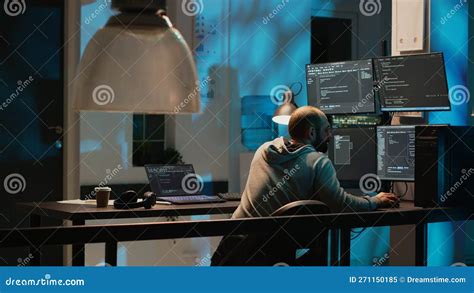 It System Engineer Coding Interface On Multiple Monitors Stock Image