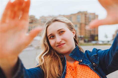 Premium Photo A Cool Teenage Girl Takes A Selfie On The Street A