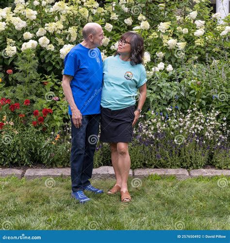 Year Old Caucasian Man And His Year Old Korean Wife Posing Before A Bed Of Beautiful
