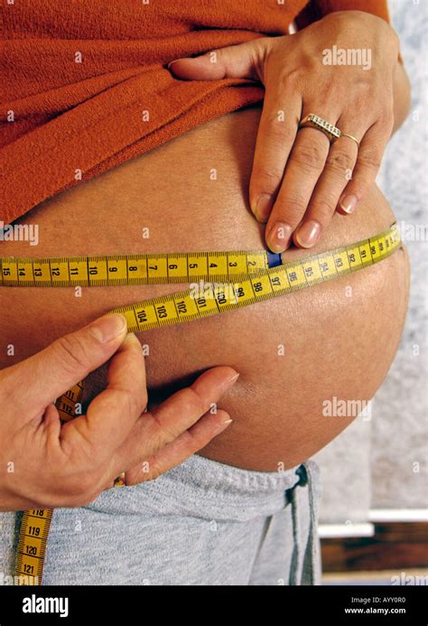 Pregnant Woman Measuring Her Belly Stock Photo Alamy