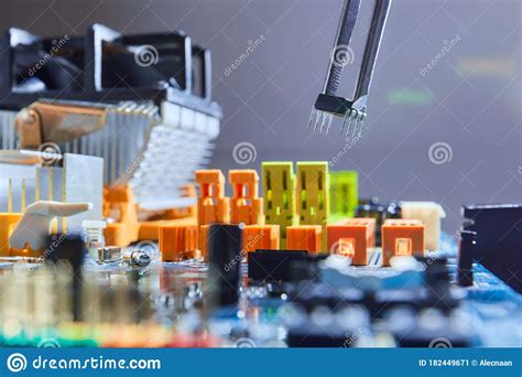Electrician Man Fixing Microelectronic Board Holding The Microchip In