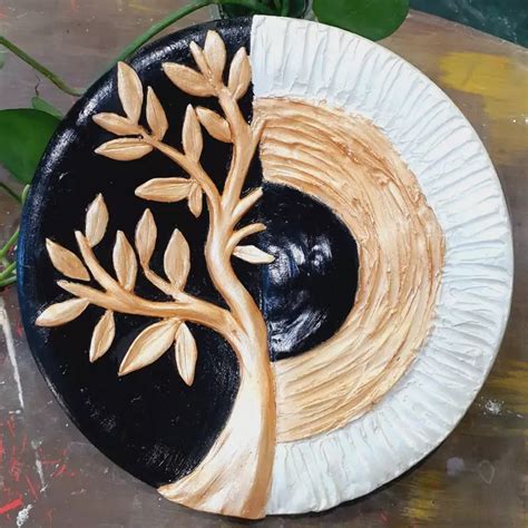 خرید و قیمت دیوار کوب سفالی طرح درخت و شب از غرفه زیورآلات دستساز عاج نو