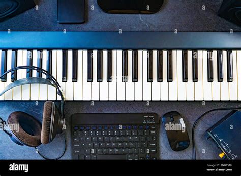 Keyboard Or Synthesizer With Headphones And Sound Card Computer Recording And Music Production