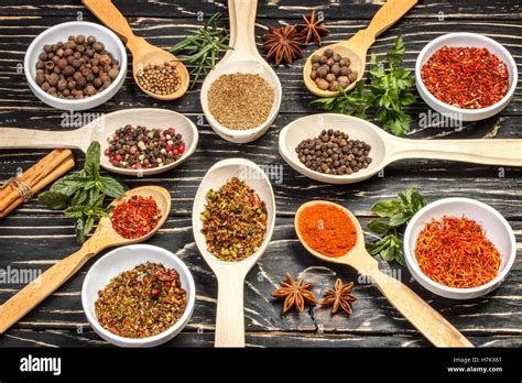Colorful Aromatic Indian Spices And Herbs On An Old Oak Wooden Brown