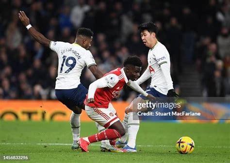Bukayo Saka Of Arsenal Challenged By Ryan Sessegon And Son Heung Min News Photo Getty Images