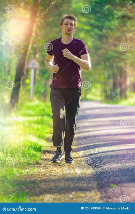 Man Jogging In City Partk At Beautiful Summer Day Sport Fitness Model Caucasian Ethnicity