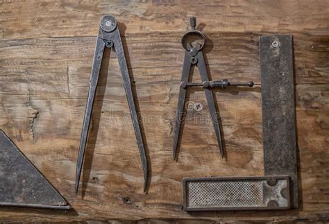 Antique Tools Of Carpenter On A Wood Antique Compass To Trace And A Square For Wood Edging