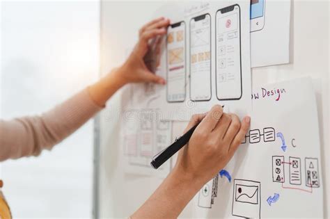 close up ux developer and ui designer brainstorming interface wireframe design creative digital