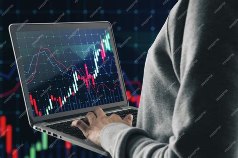 Premium Photo Close Up Of Hacker Hand Using Laptop With Glowing Forex Chart On Blurry Dark