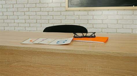 Empty Elementary School Classroom With Desks Chairs And Chalkboard