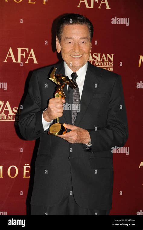 The Philippines Actor Eddie Garcia Poses With His Trophy After Winning
