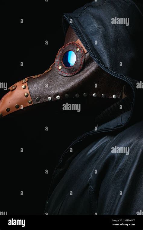 Plague Doctor With Crow Like Mask Isolated On Black Background Creepy