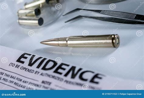 Criminalistic Laboratory Scientific Police Officer Holds Bullet Tips