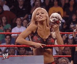 Torrie Wilson Blowing Kisses While Holding Her Dog 
