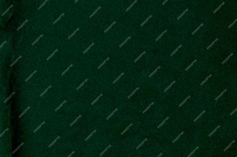 부드럽고 매끄러운 섬유 소재의 배경 녹색 패브릭 배경으로 사용되는 녹색 벨벳 패브릭 질감 텍스트 X9를 위한 공간이 있습니다 프리미엄 사진